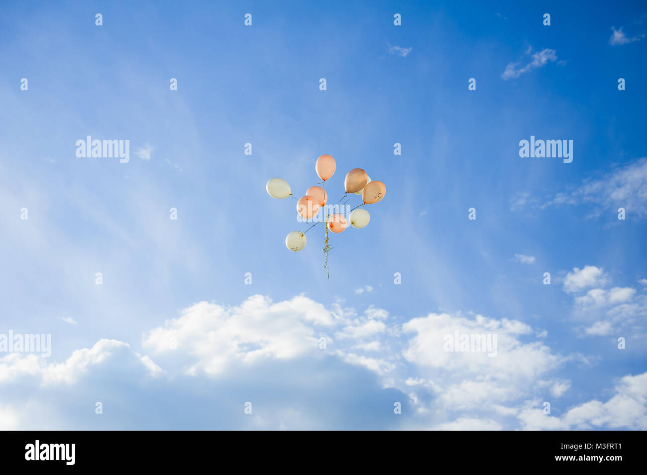 Helium balloons sky clouds nobody hi-res stock photography and images ...