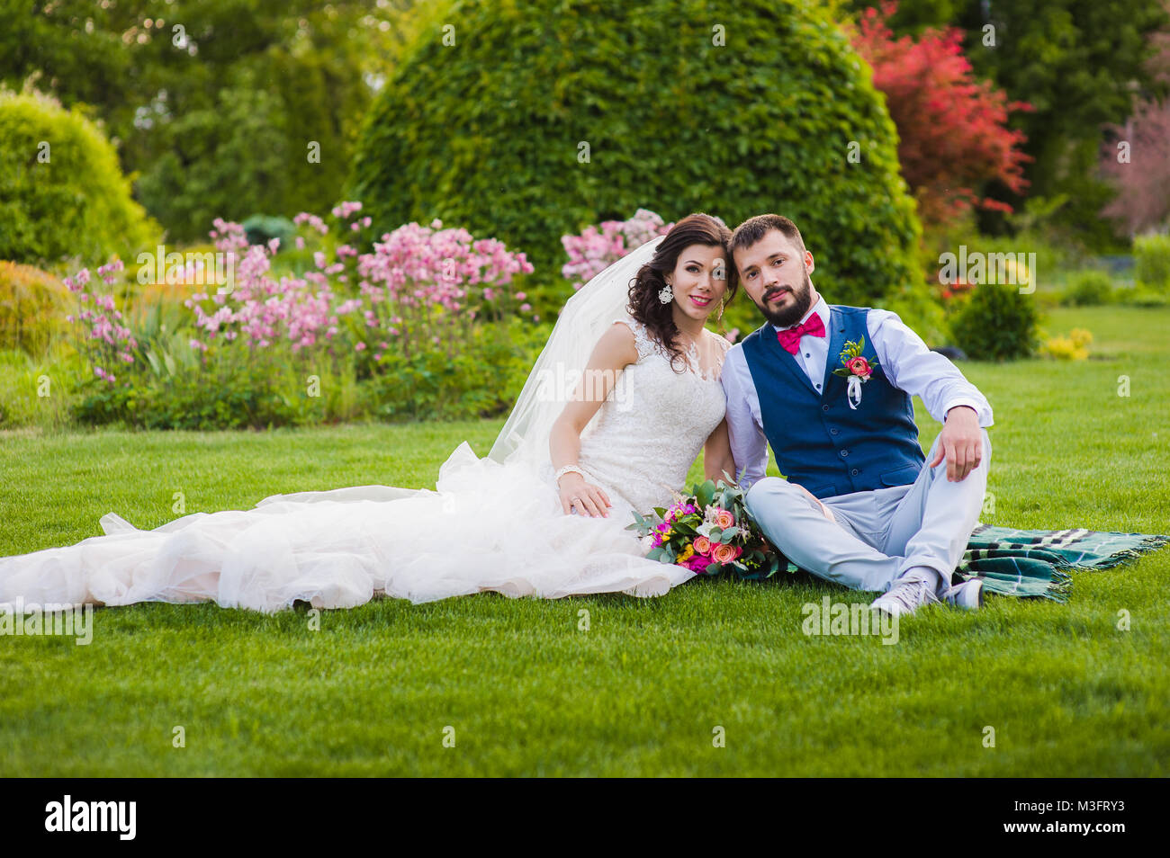 Attractive woman and man celebrate their marriage in nature green ...