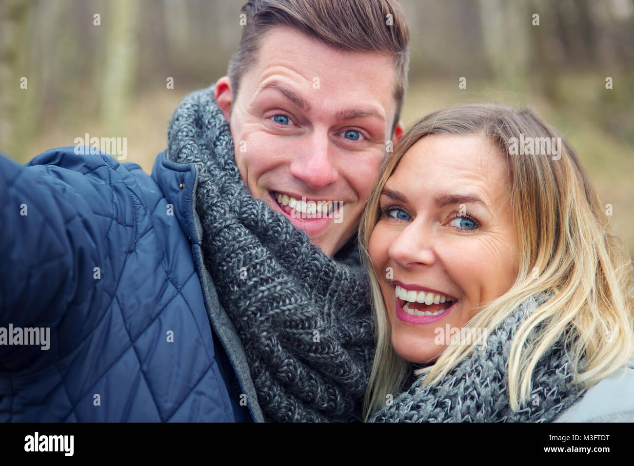 selfie of beautiful young couple outdoors in the cold Stock Photo - Alamy