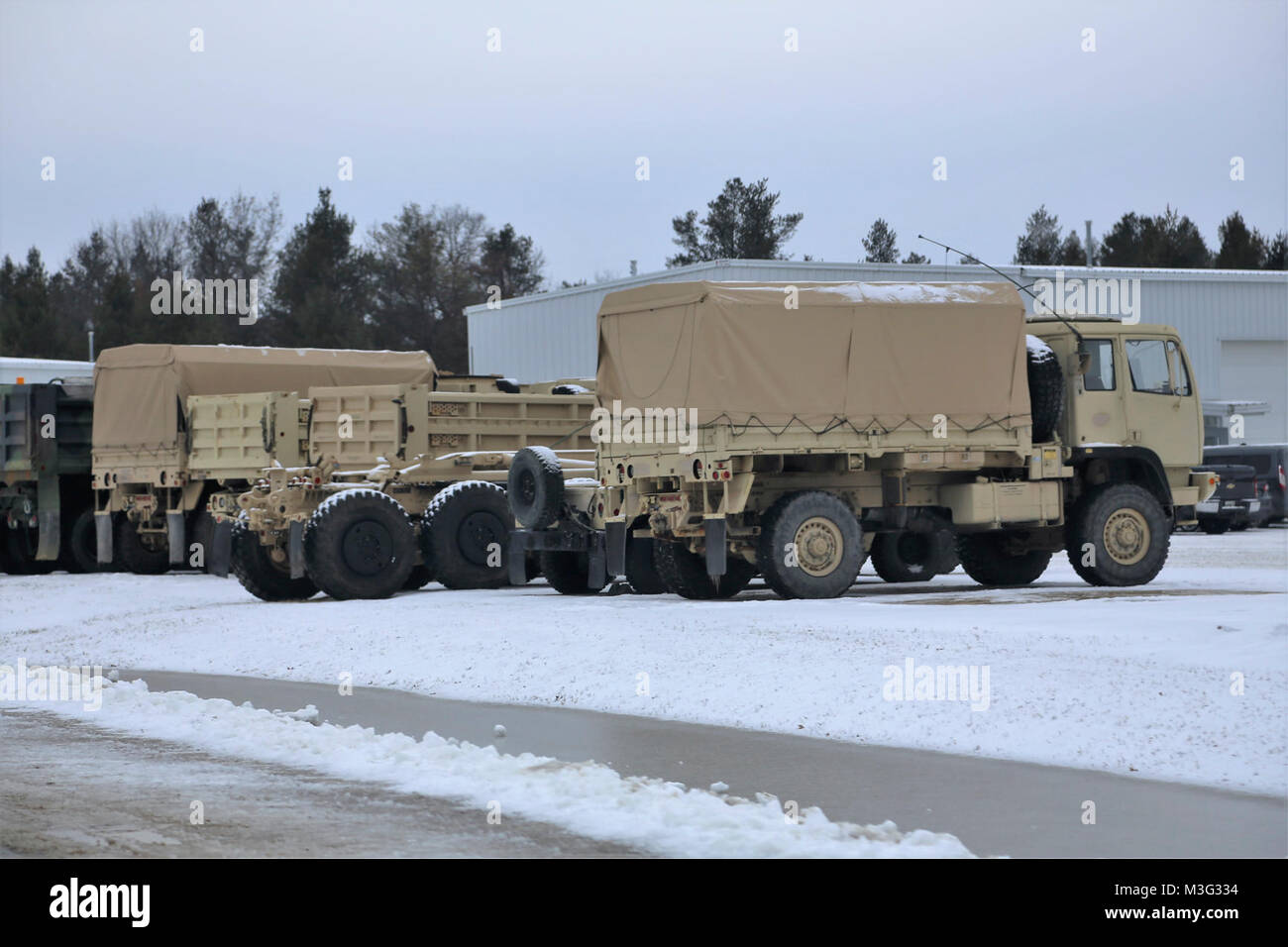 Army military vehicles are parked at a staging area Jan. 24, 2018, on ...