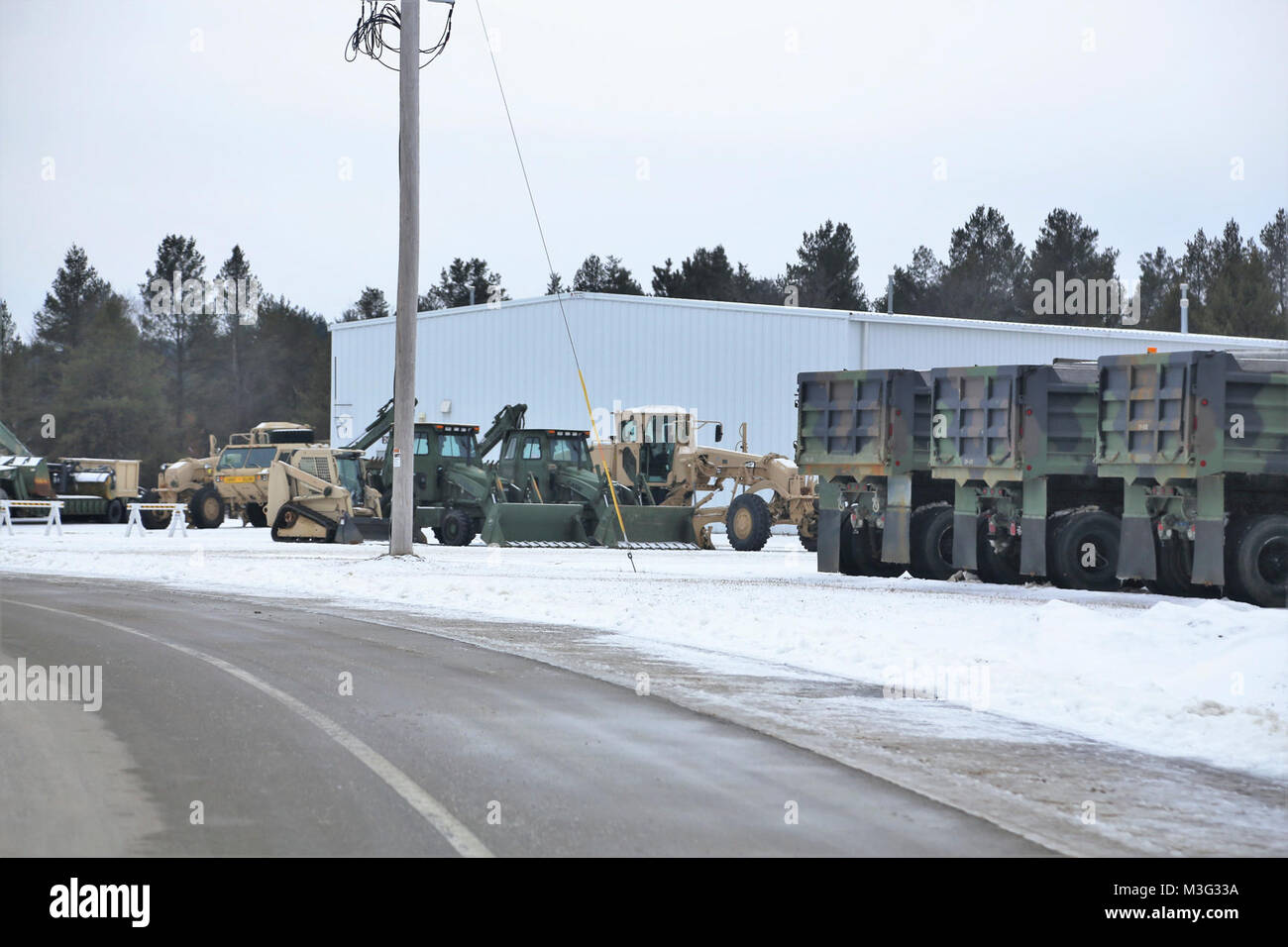 Army military vehicles are parked at a staging area Jan. 24, 2018, on ...