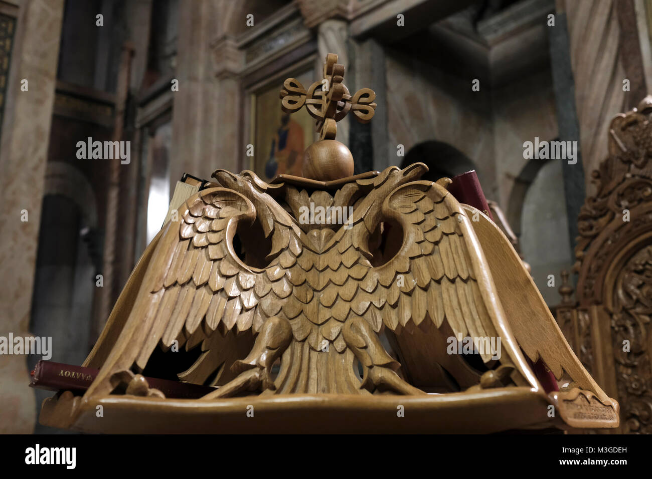 A carved wooden lectern inside the Katholikon or Catholicon Chapel in ...
