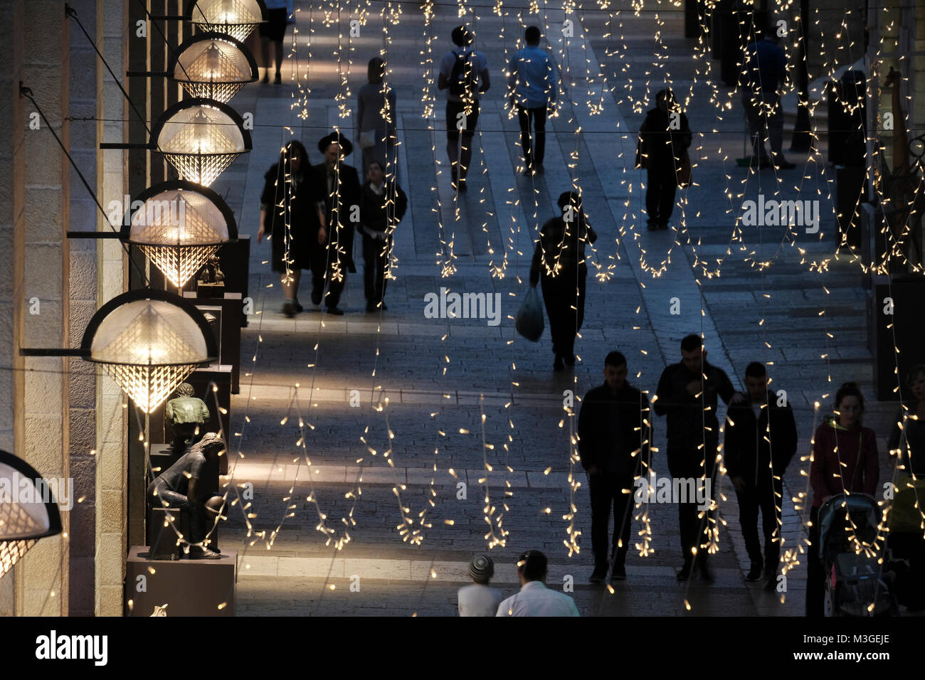Pedestrians walk at night along Mamilla Mall, also known as Alrov ...