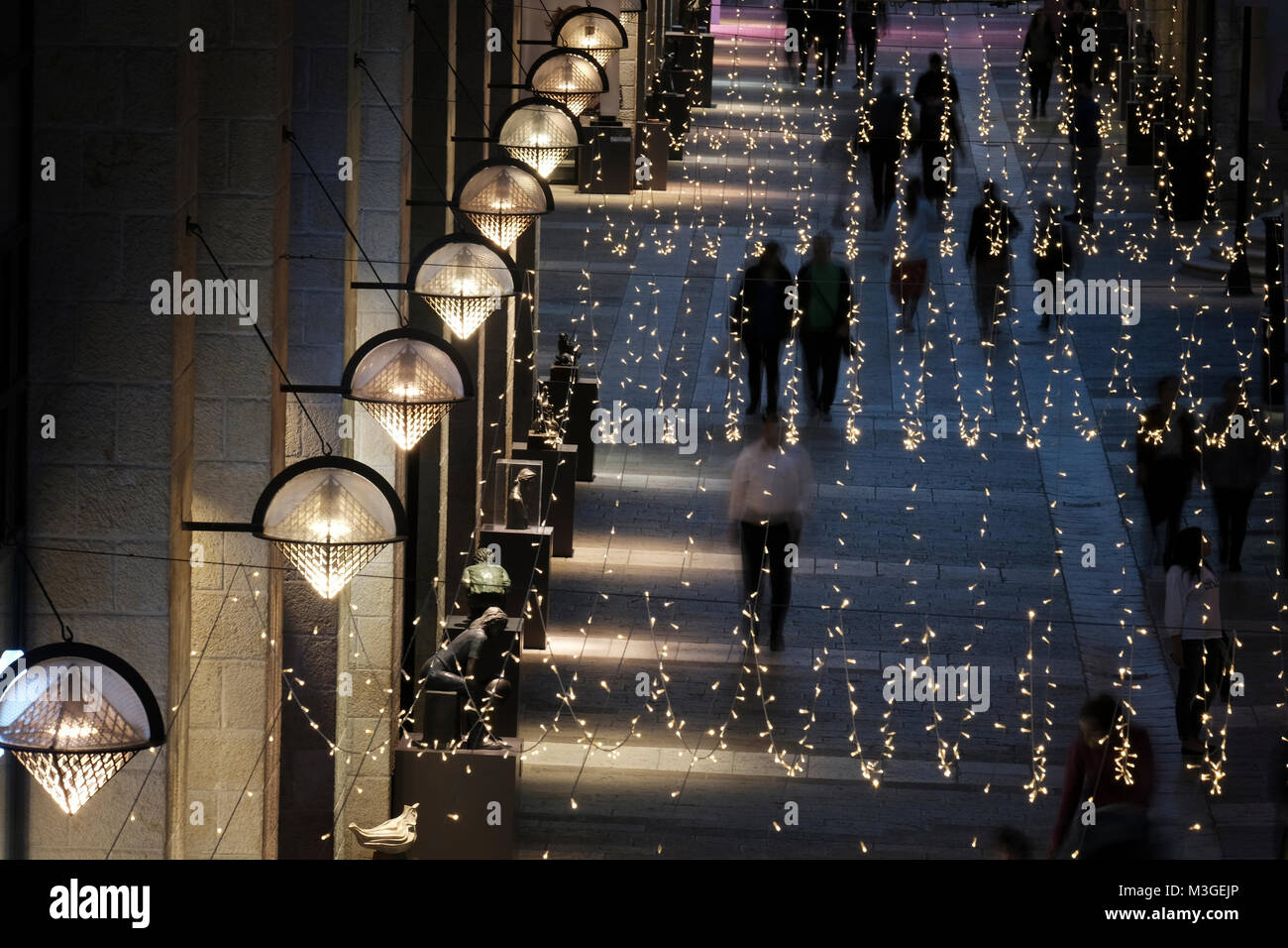 Pedestrians walk at night along Mamilla Mall, also known as Alrov ...