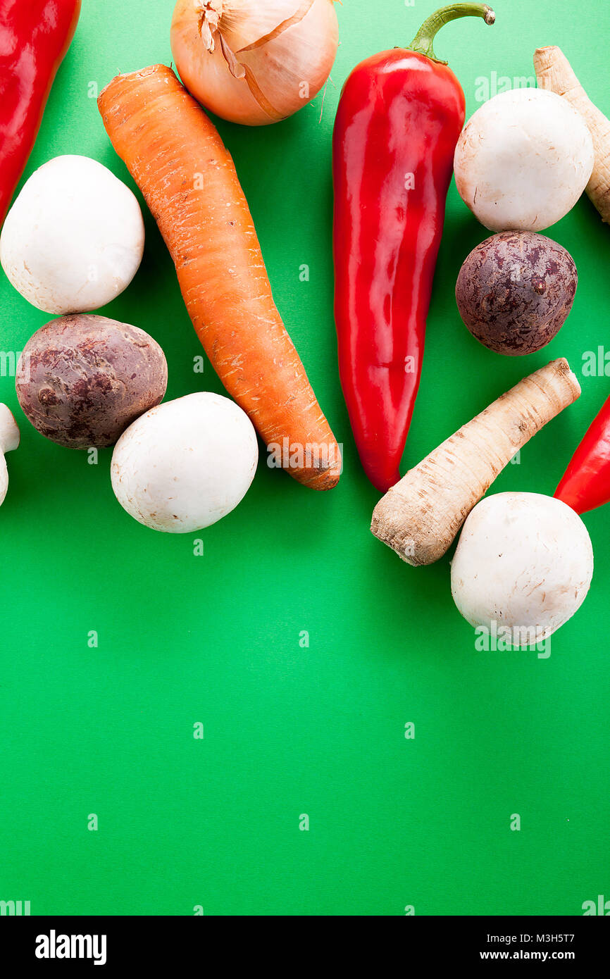 Top view of vegetables on green background Stock Photo - Alamy