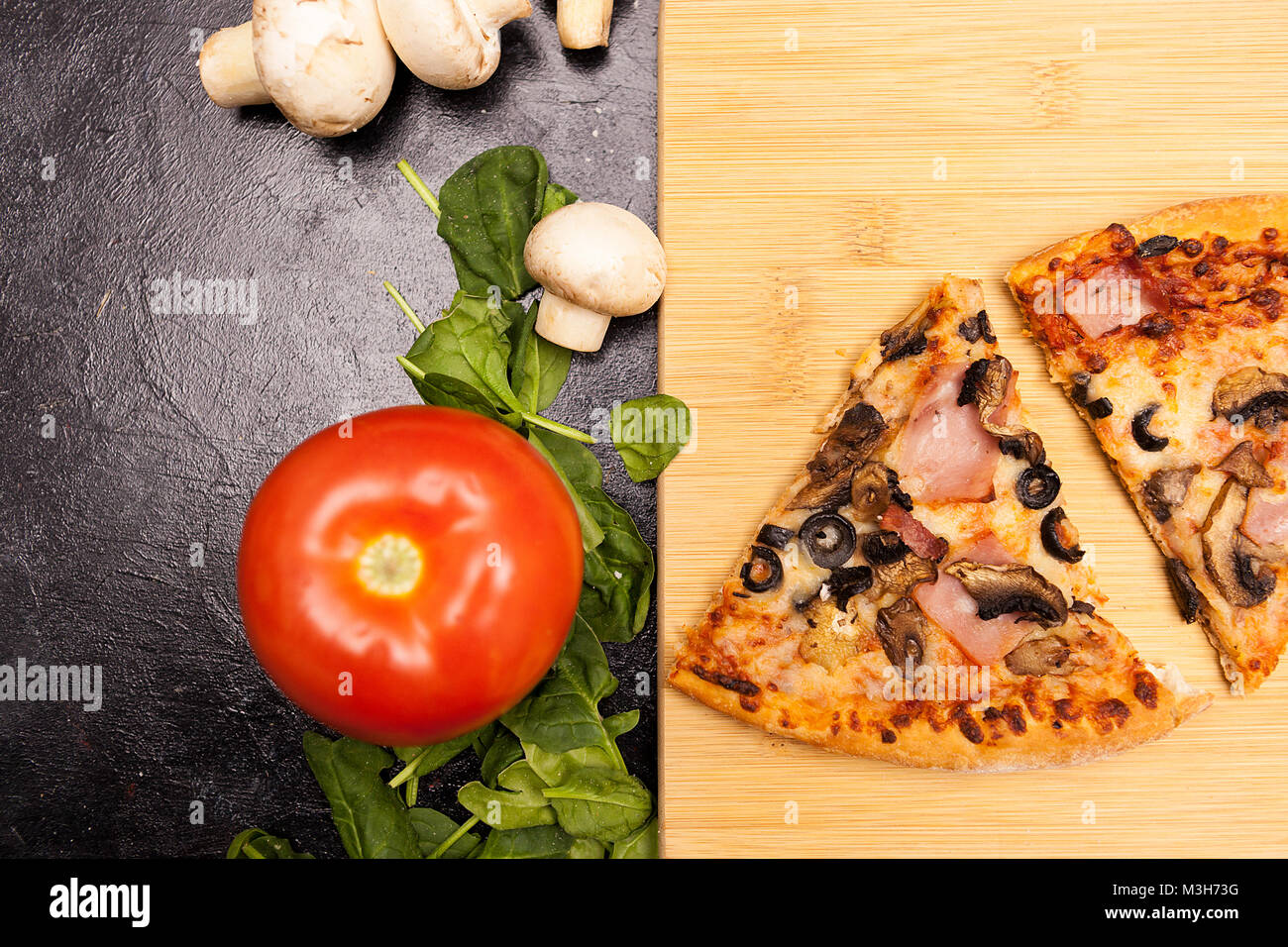 Top view on slices of pizza on a board Stock Photo - Alamy