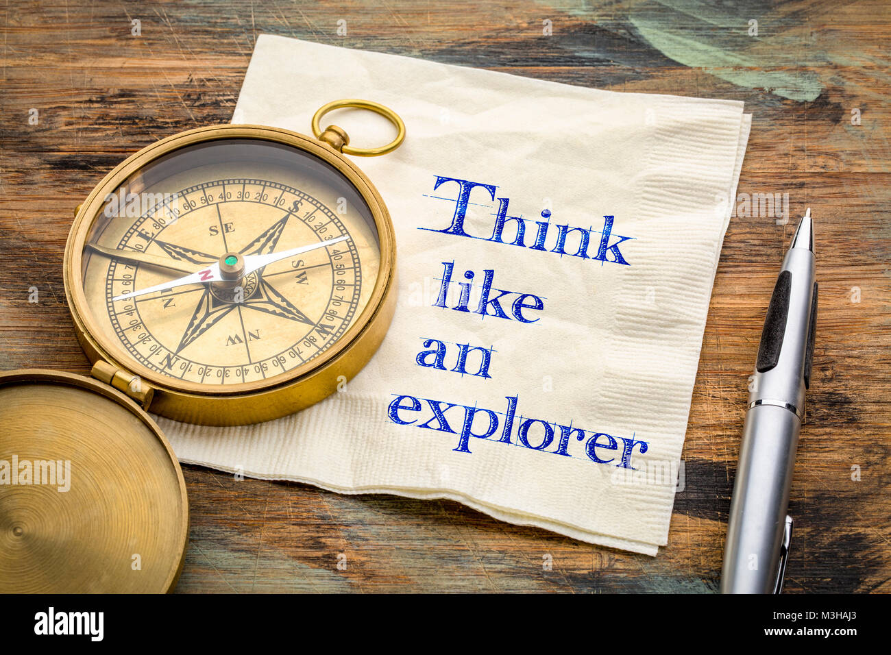 Think like an explorer - inspiraitonal handwriting on a napkin with an ...