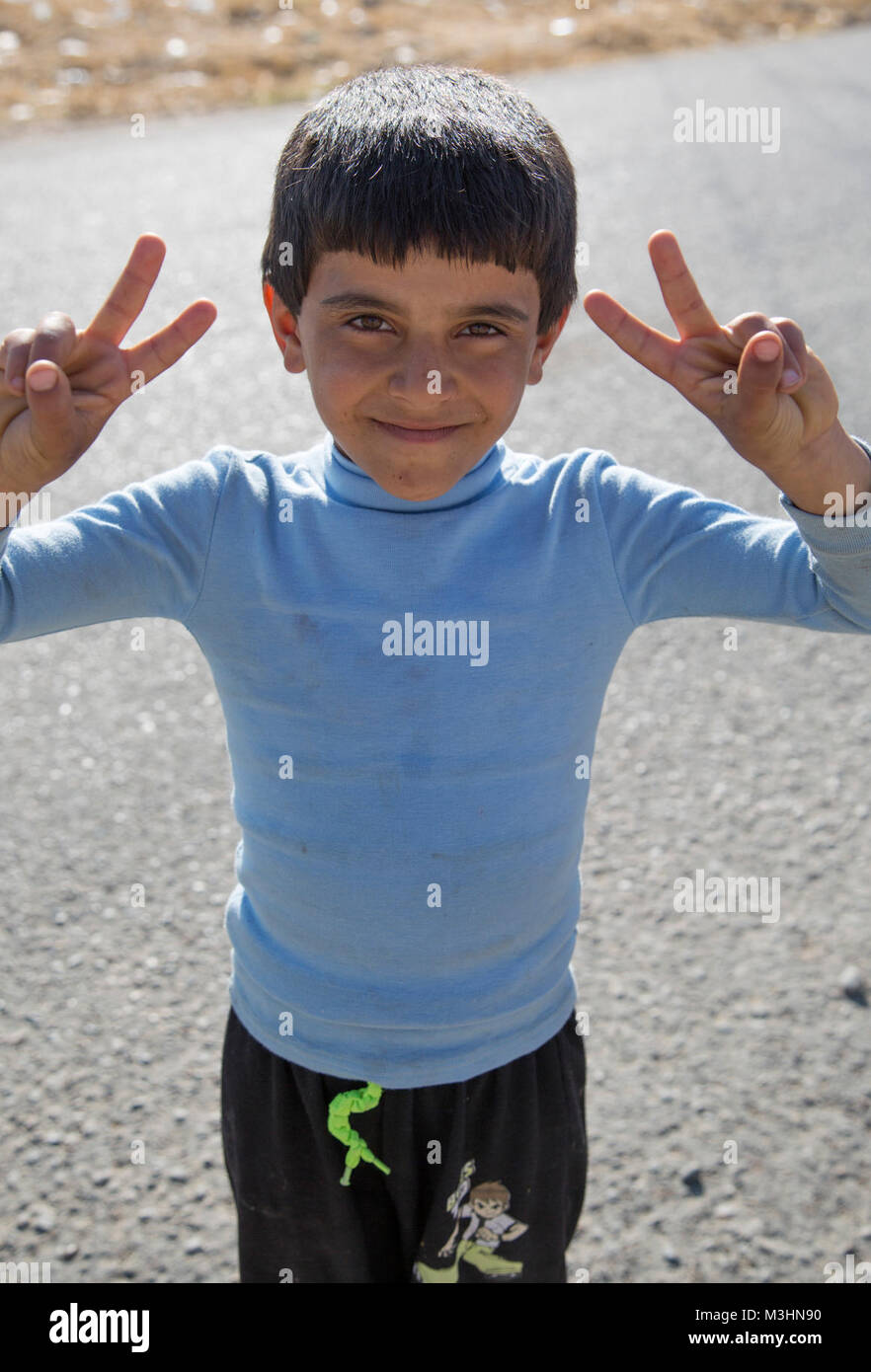 A young Iraqi boy poses for a Stock Photo - Alamy