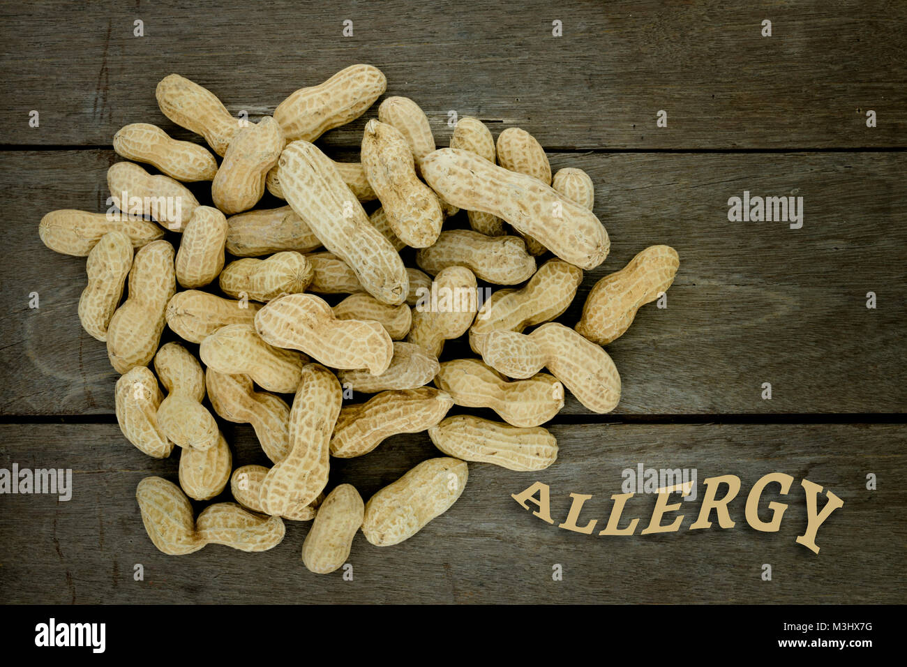 Peanut or groundnut food allergy health concept, close up on wooden ...