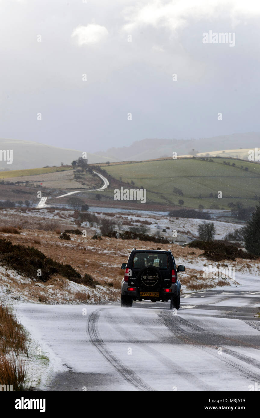 Builth Wells, Powys, UK. 11th February 2018. A vehicle drives through a ...