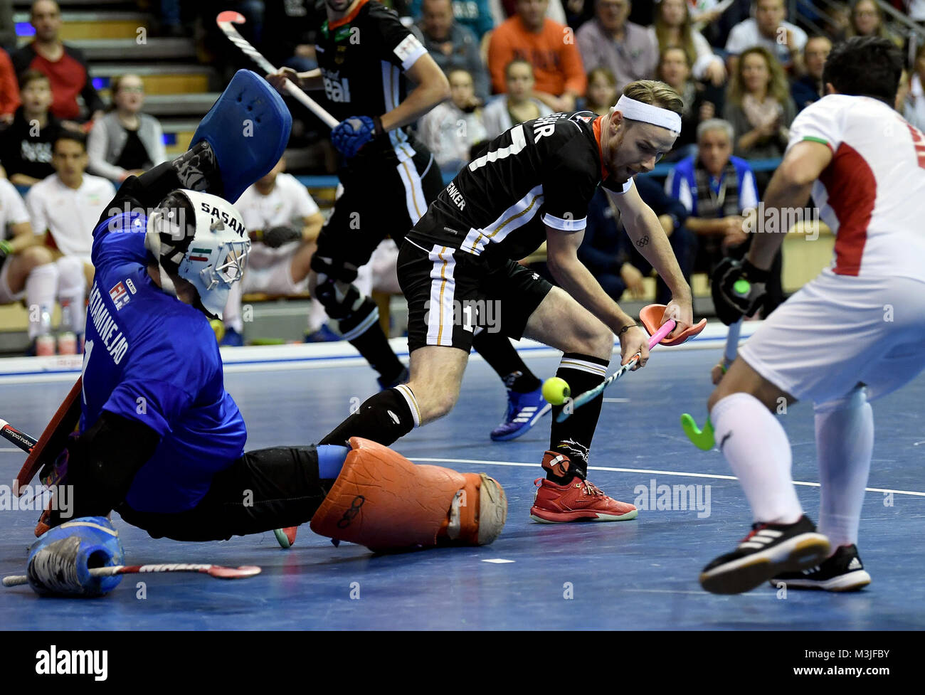 Christopher Ruehr (C) of Germany in action against goalkeeper Sasan ...