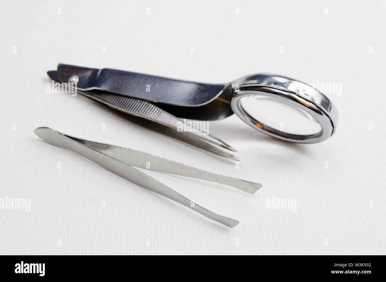 A Studio Photograph of a Pair of Metal Tweezers Stock Photo - Alamy