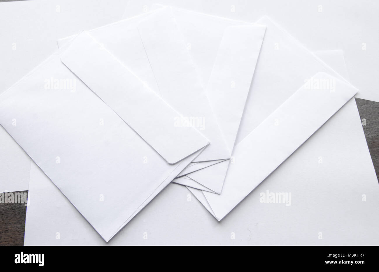 white blank envelopes on white background Stock Photo - Alamy