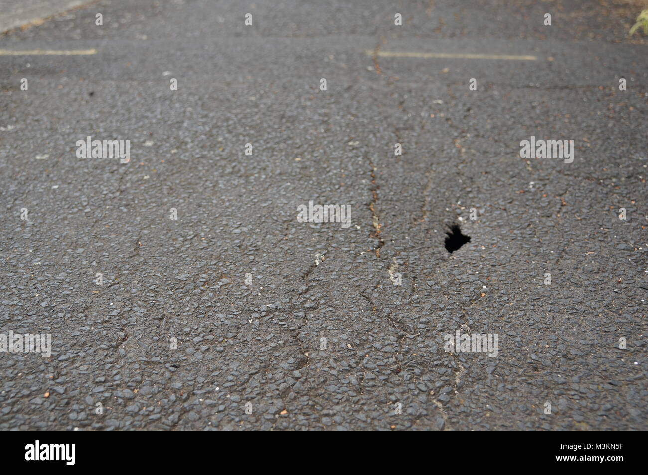 Hole in the way Stock Photo - Alamy