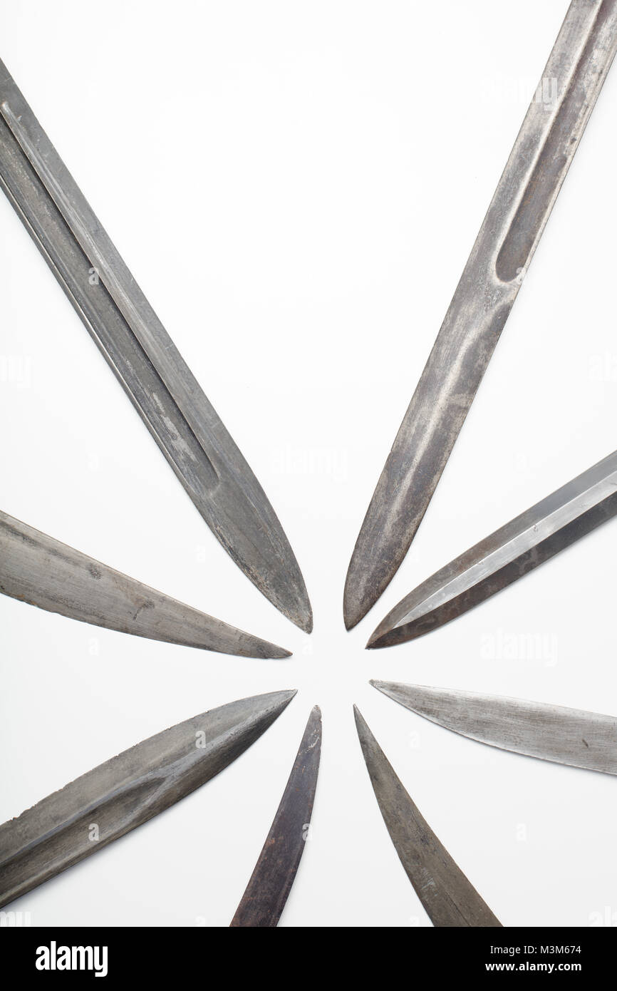 Collection of knife or dagger blades and swords arranged in a still ...