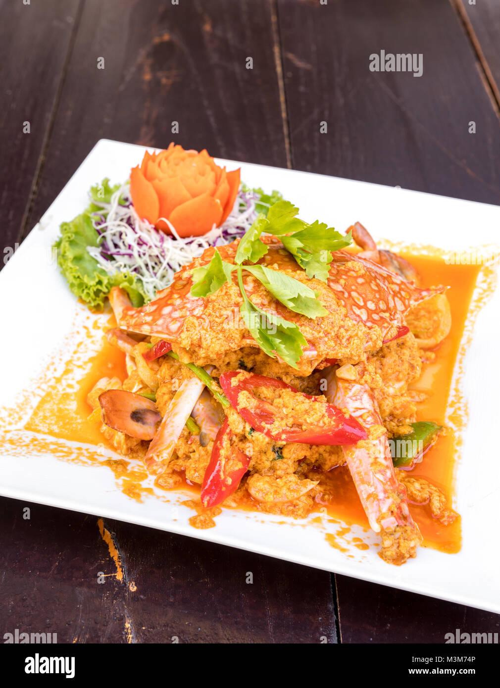 Fried curry blue crab with egg Stock Photo - Alamy