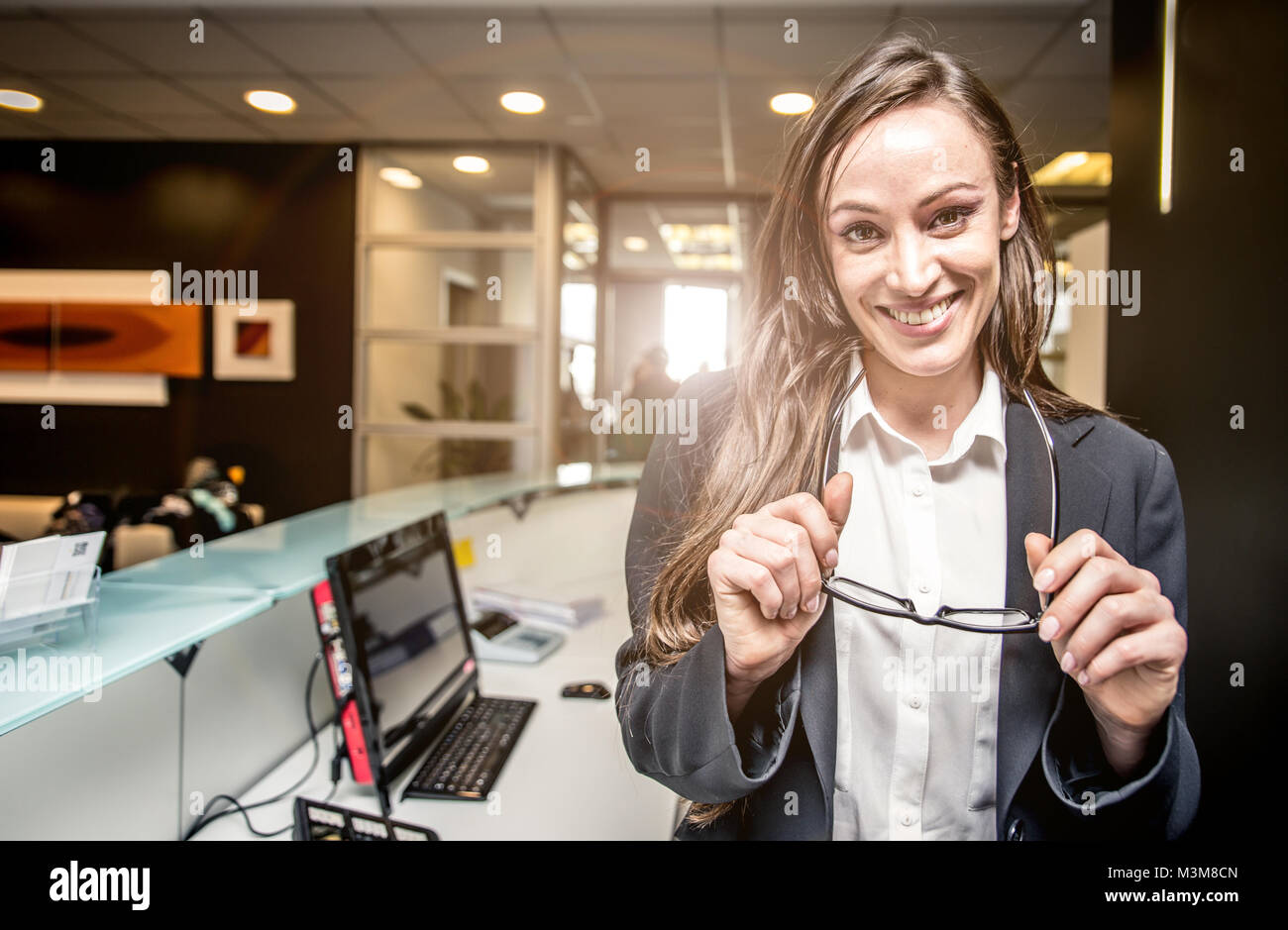 Secretary portrait in an office Stock Photo - Alamy