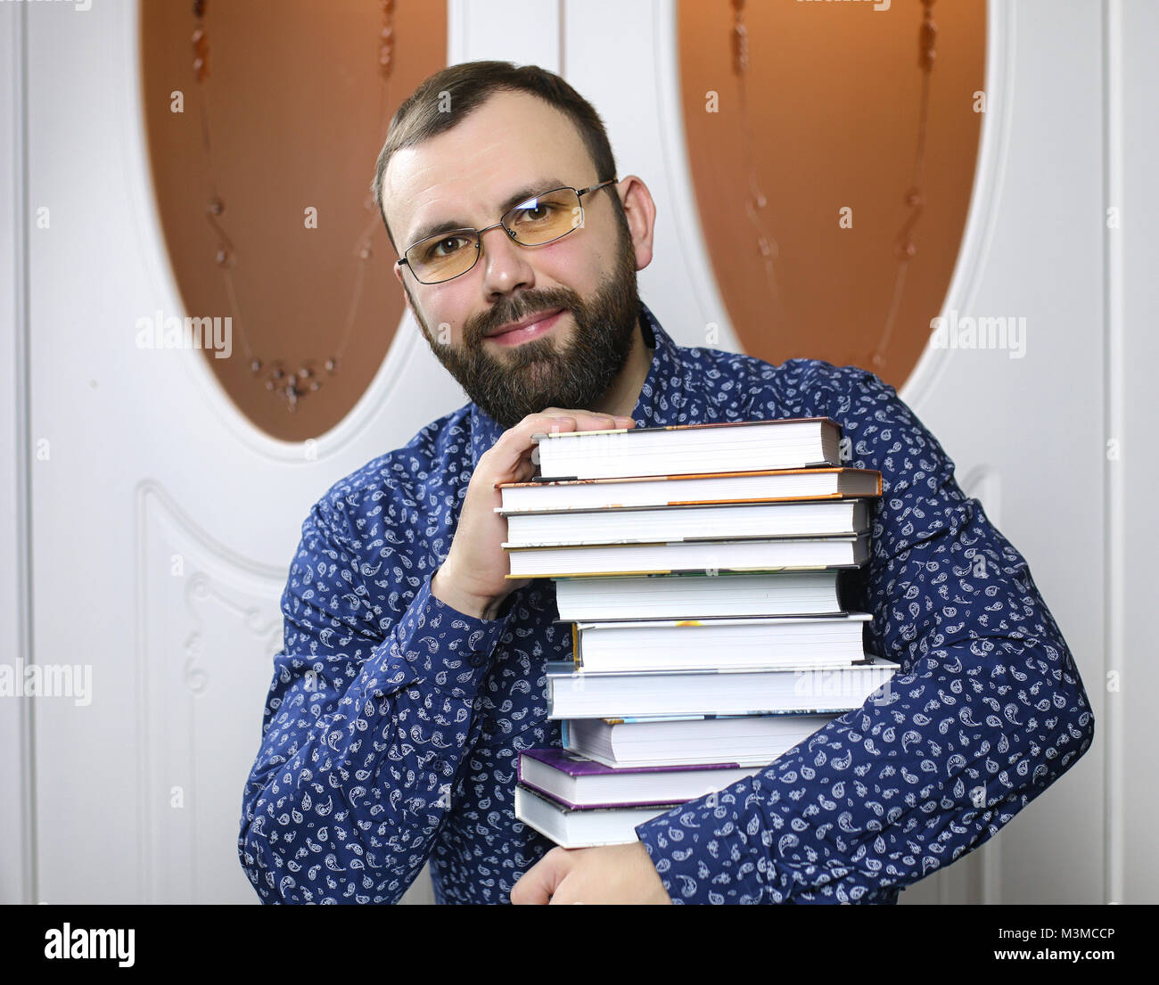 A young bearded man with textbooks Stock Photo - Alamy