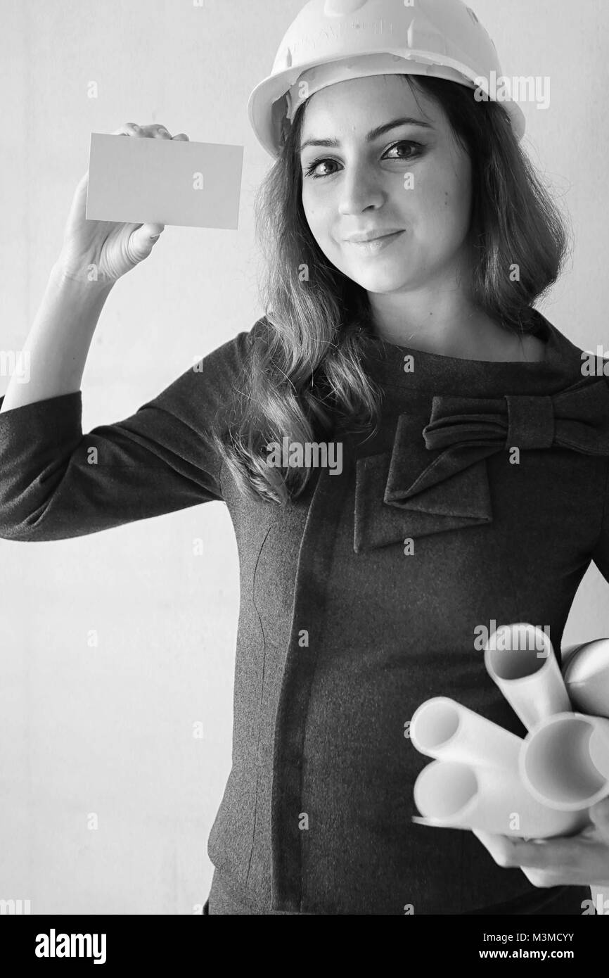 girl with a blank sheet of paper in his hand on construction sit Stock ...