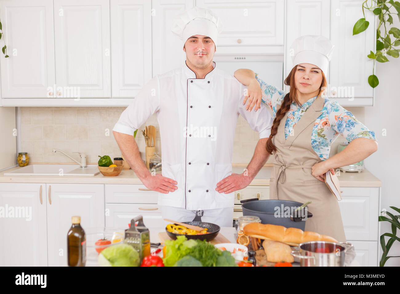 A senior chef giving cooking lesson to young chefs Stock Photo - Alamy
