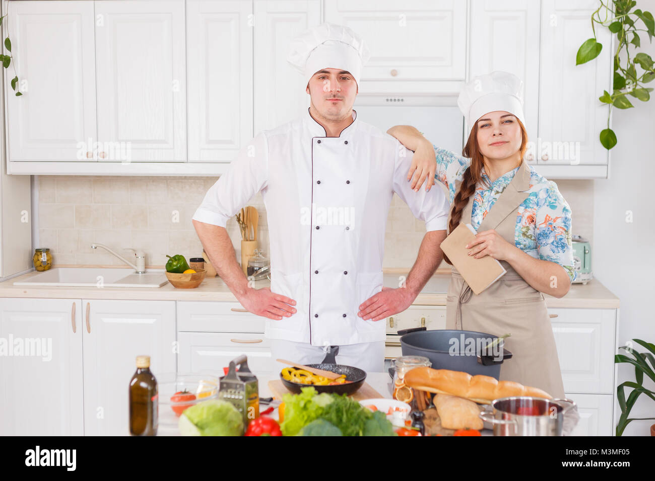 A senior chef giving cooking lesson to young chefs Stock Photo - Alamy