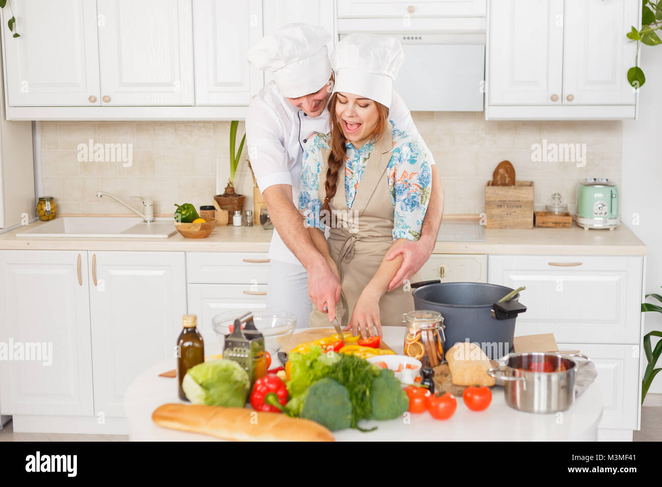 A senior chef giving cooking lesson to young chefs Stock Photo - Alamy