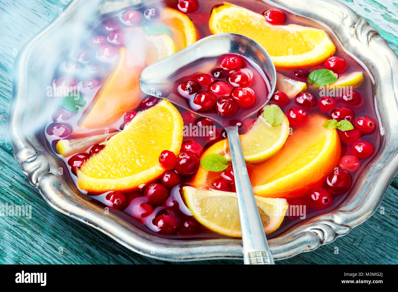 Steam alcoholic cocktail with citrus and cranberry. Alcohol concept ...