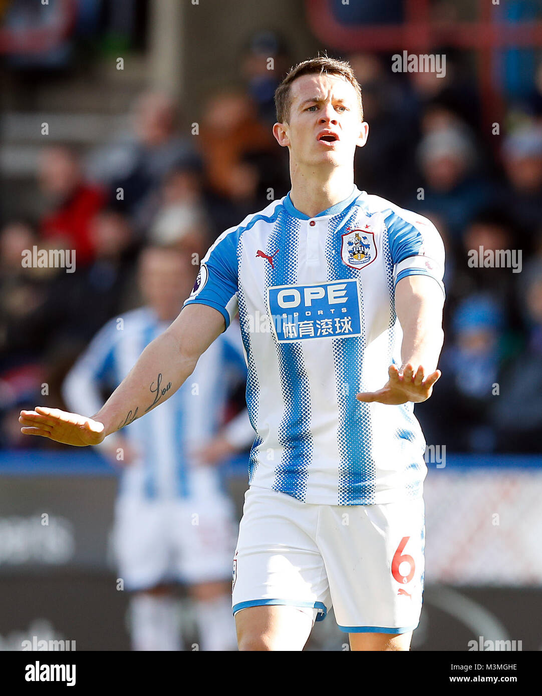 Huddersfield Town's Jonathan Hogg giving instructions to his team mates ...