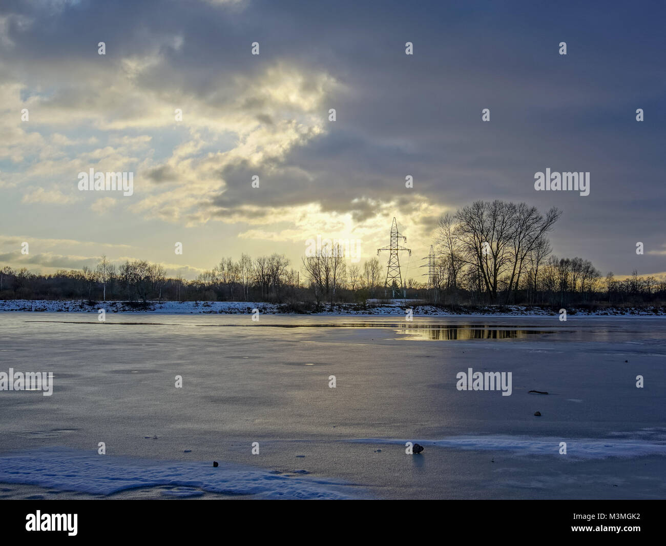 colorful winter sunset on frozen river ice with dramatic clouds Stock ...
