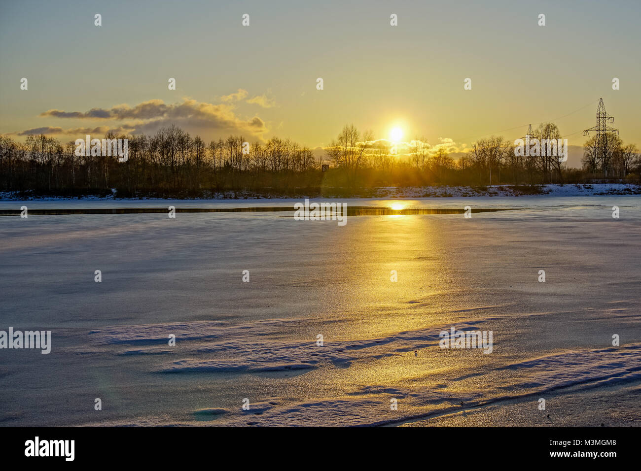 colorful winter sunset on frozen river ice with dramatic clouds Stock ...