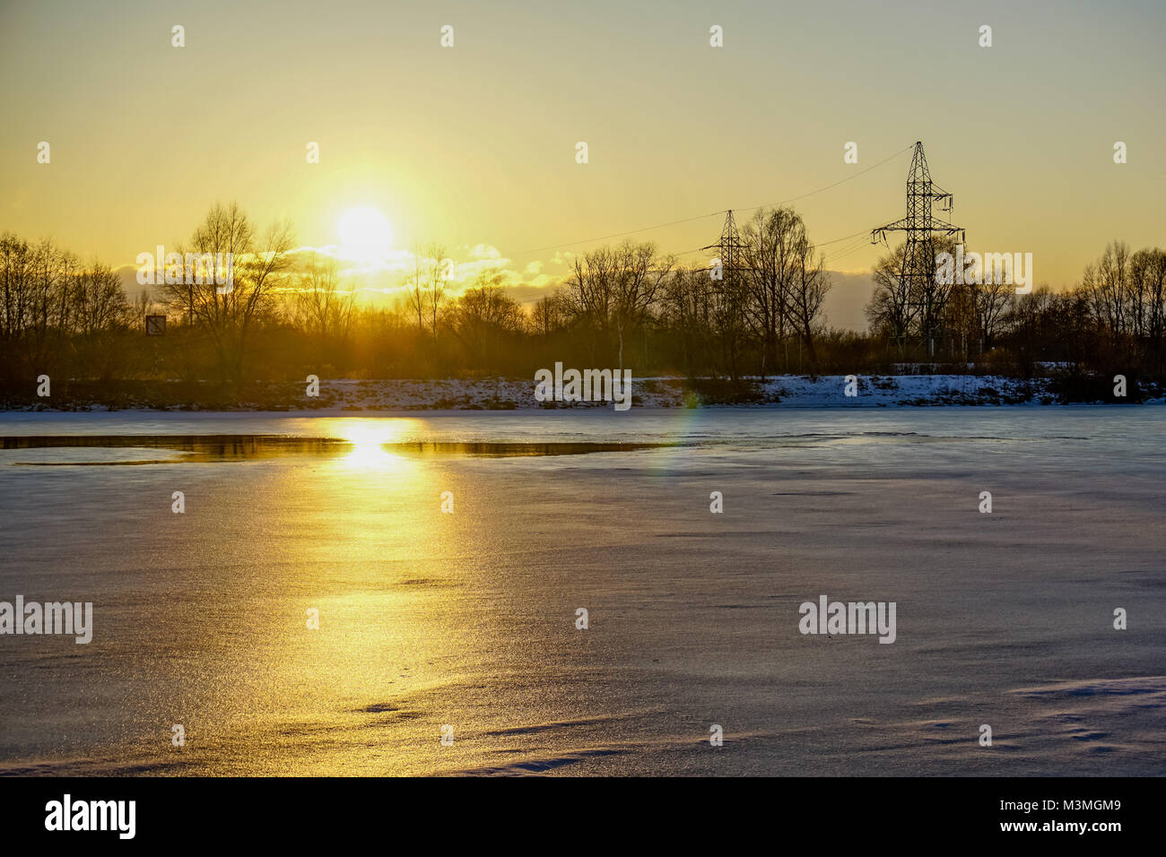 colorful winter sunset on frozen river ice with dramatic clouds Stock ...
