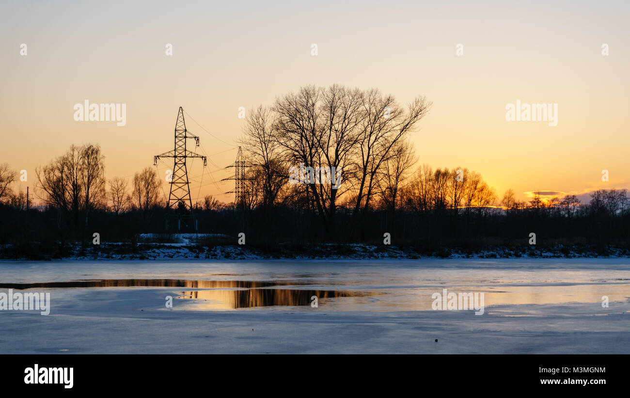 colorful winter sunset on frozen river ice with dramatic clouds Stock ...
