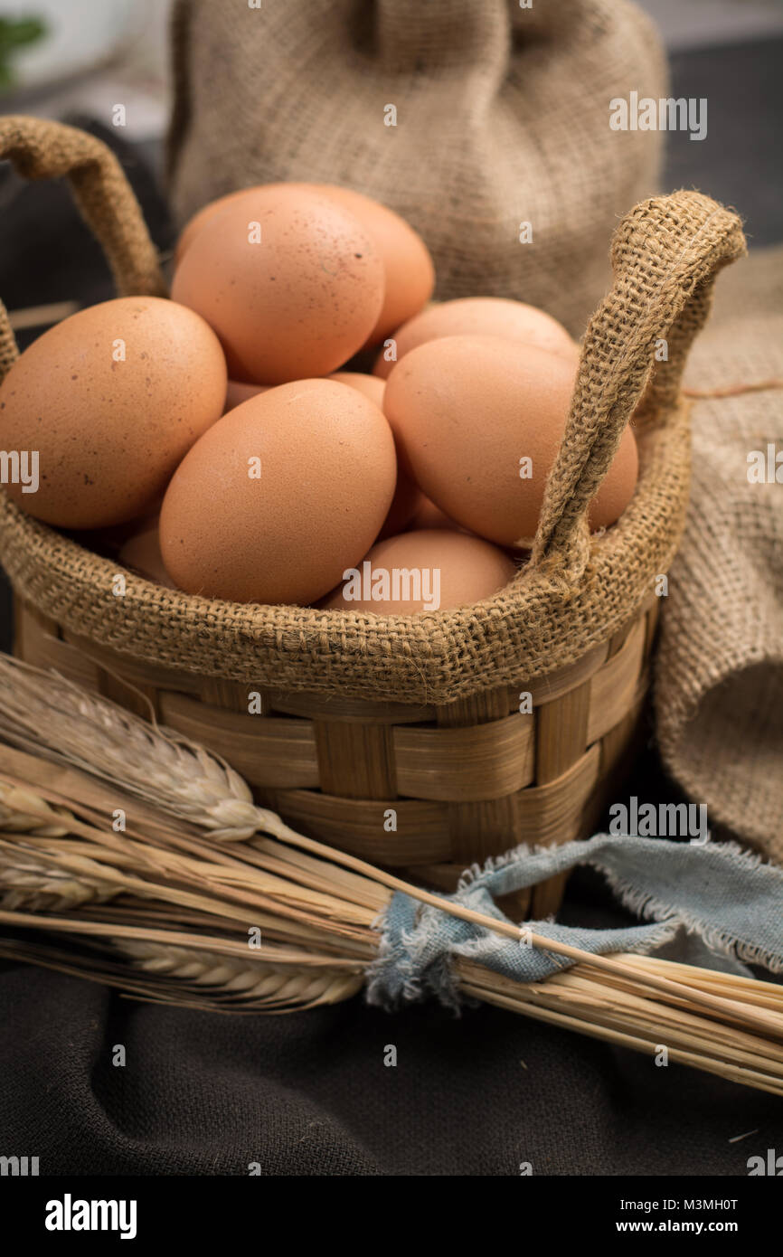 Brown farmers cage-free chicken eggs in basket, close up Stock Photo ...