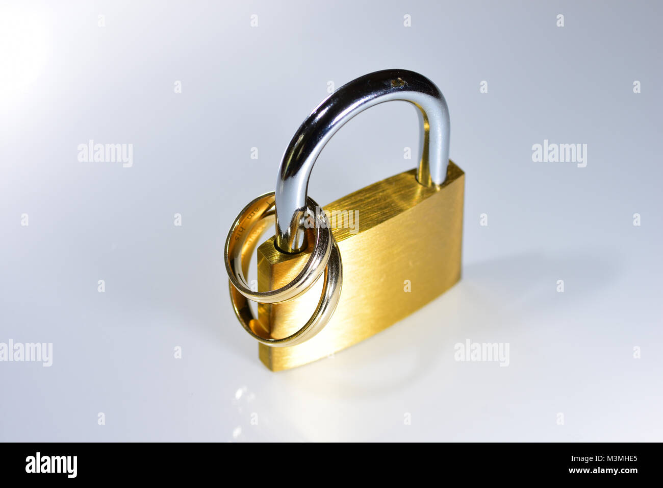 Together forever. Golden wedding ring locked for forever love Stock ...