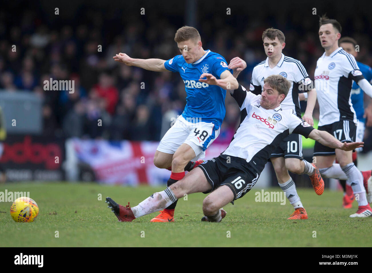 Rangers' Greg Docherty (left) and Ayr United's Jamie Adams battle for ...