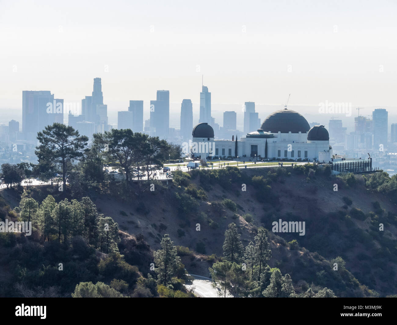 Aerial view of Griffith Observatory and Los Angeles downtown in a sunny ...
