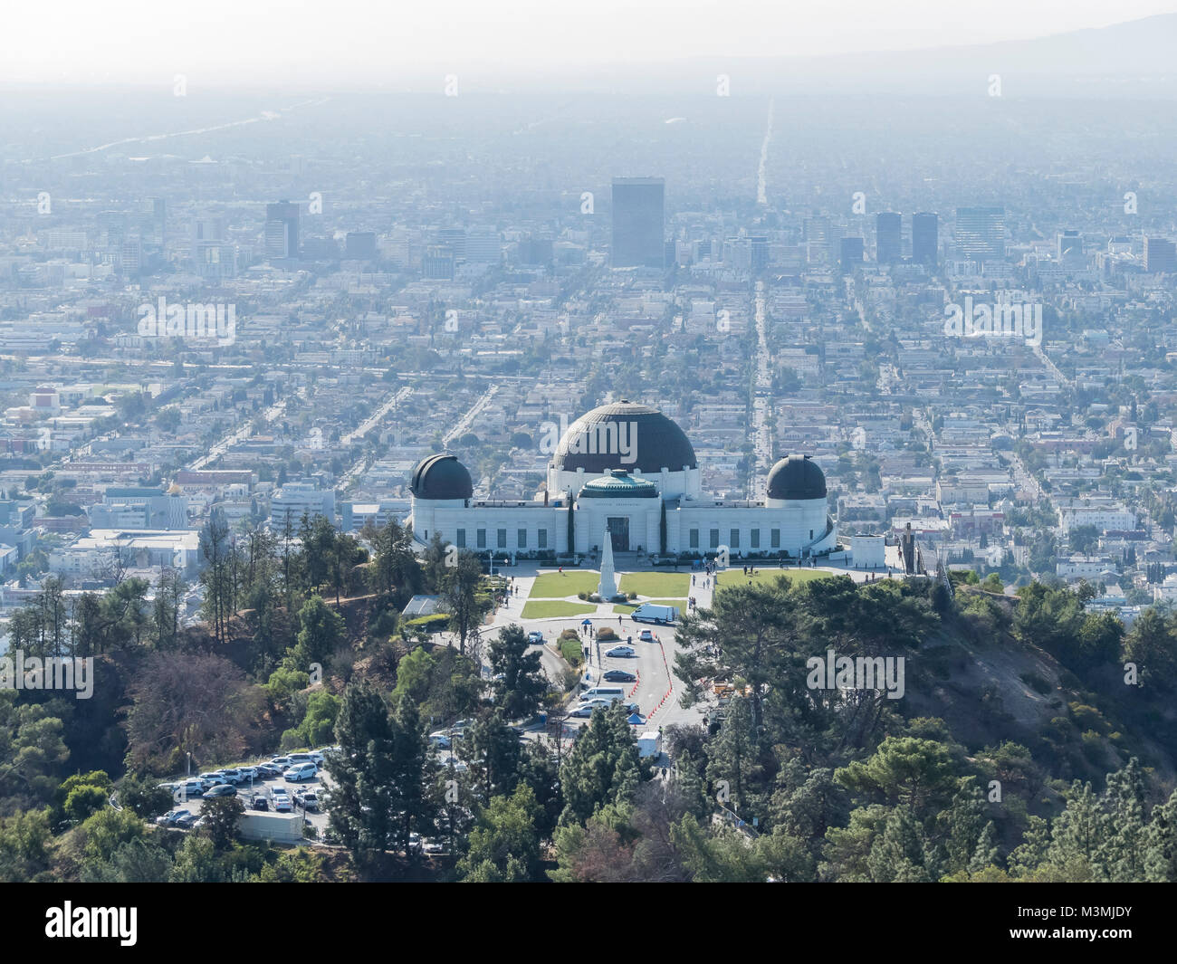 Aerial view of Griffith Observatory and Los Angeles downtown in a sunny ...