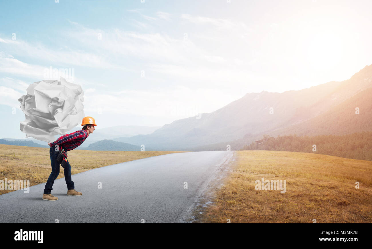 Engineer man carry load Stock Photo - Alamy