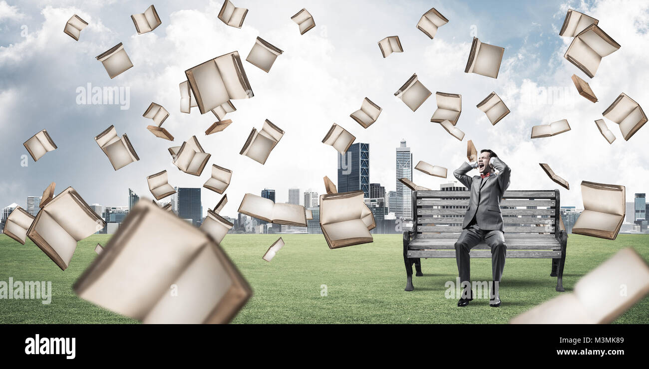 Book falling grass hi-res stock photography and images - Alamy