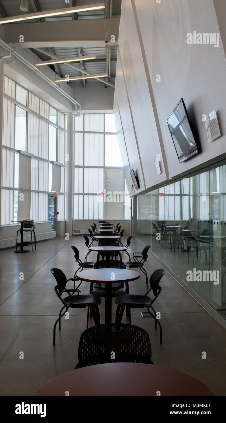 Empty eating area in modern community centre Stock Photo - Alamy