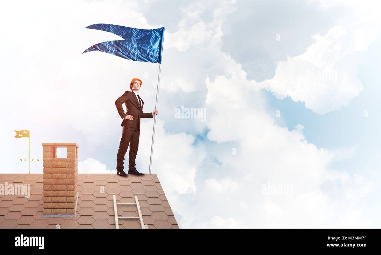 Young businessman with flag presenting concept of leadership. Mixed ...