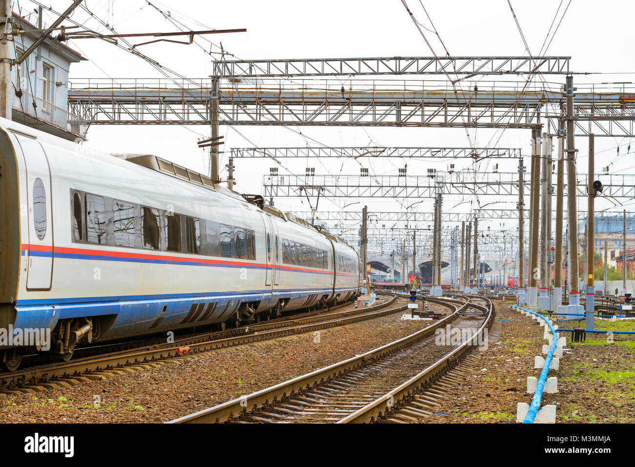 Modern hybrid electric locomotive Sapsan pulling a high-speed train on ...