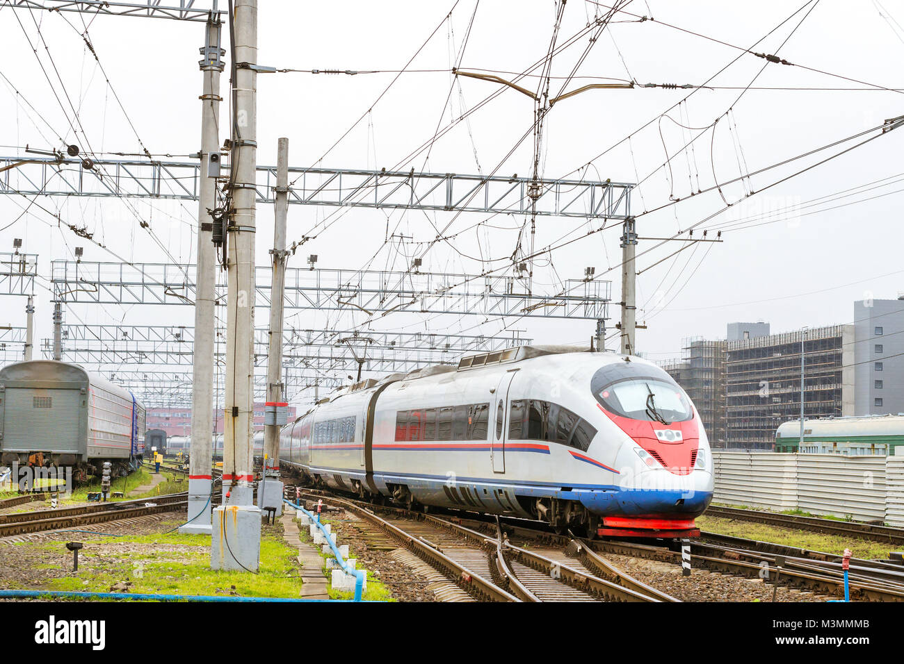 Modern hybrid electric locomotive Sapsan pulling a high-speed train on ...