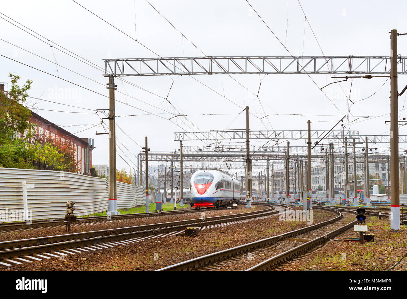 Modern hybrid electric locomotive Sapsan pulling a high-speed train on ...