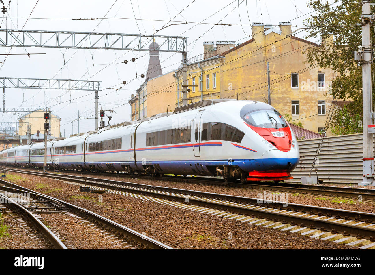 Modern hybrid electric locomotive Sapsan pulling a high-speed train on ...