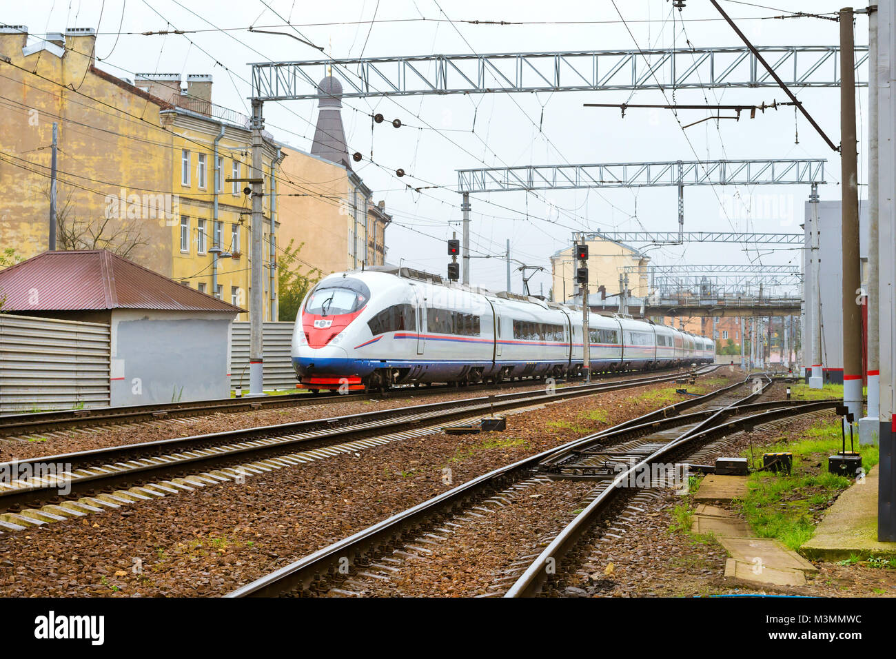 Modern hybrid electric locomotive Sapsan pulling a high-speed train on ...