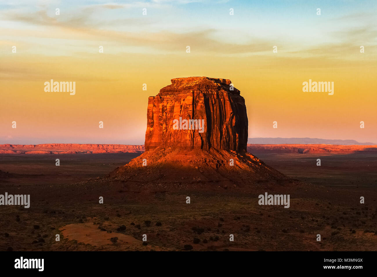 The Merrick Butte hit by the sun while it's setting down in Monument ...