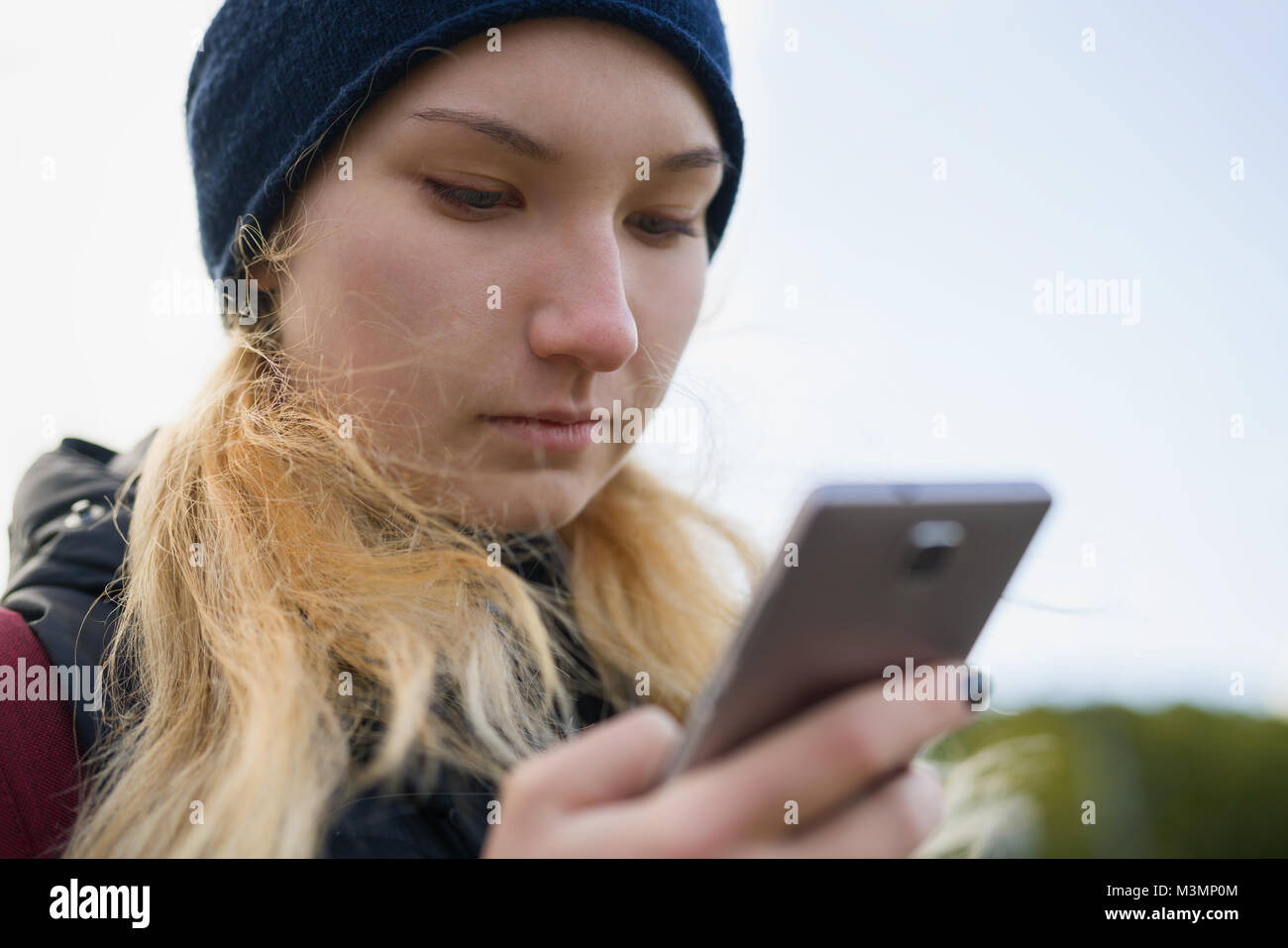 teen girl using smartphone outdoors Stock Photo - Alamy