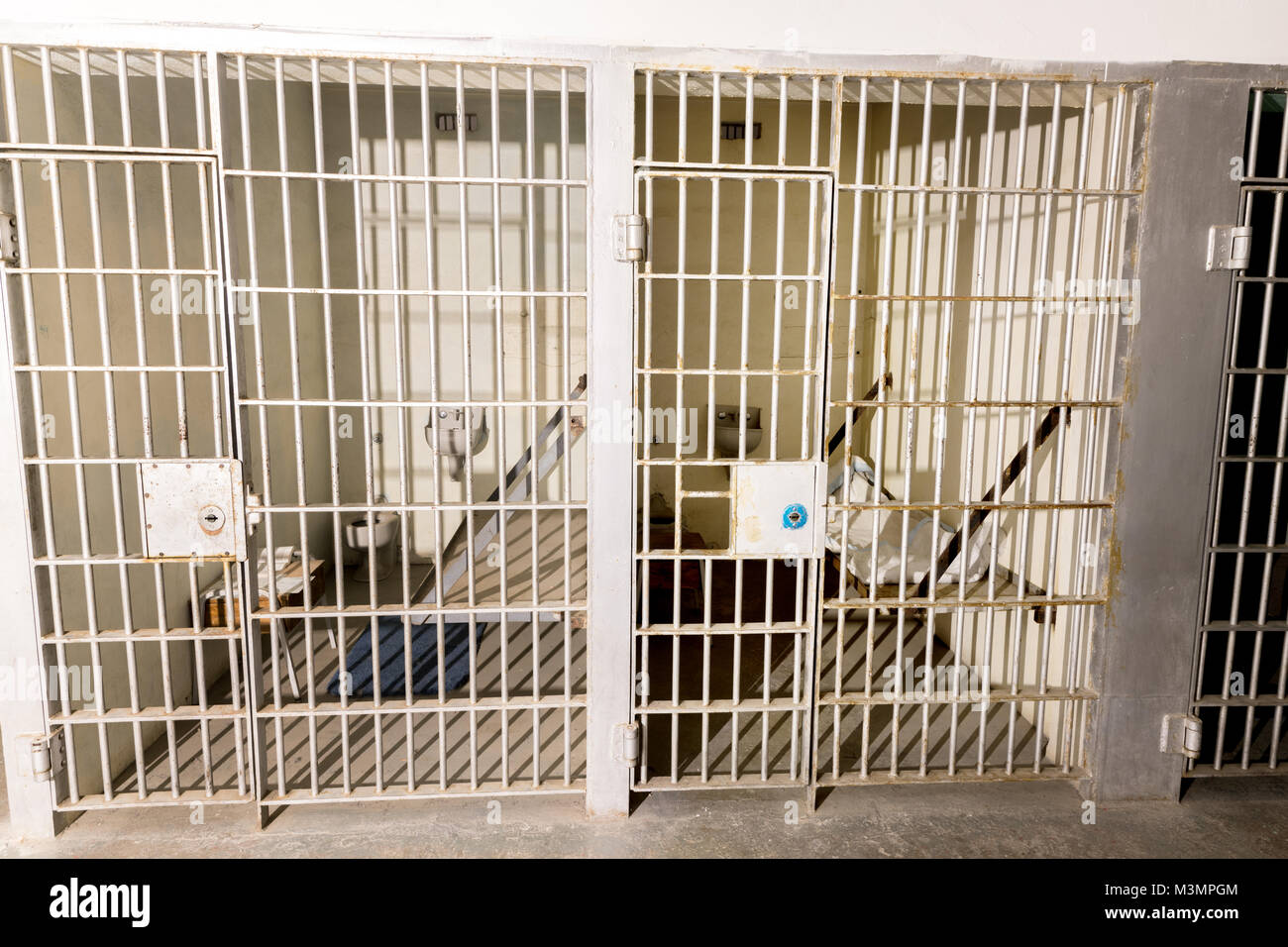 Jail cells close up of the locked bared doors Stock Photo - Alamy