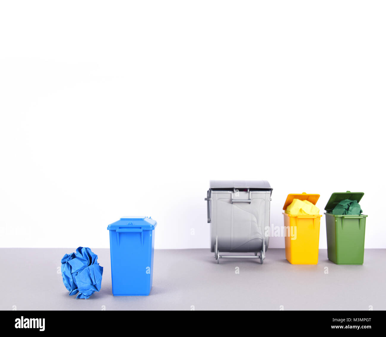 Colorful recycle bins on white background Stock Photo - Alamy